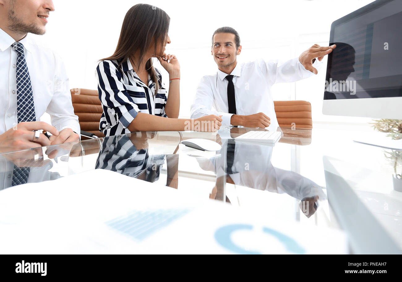 Business partners looking charts meeting hi-res stock photography and ...