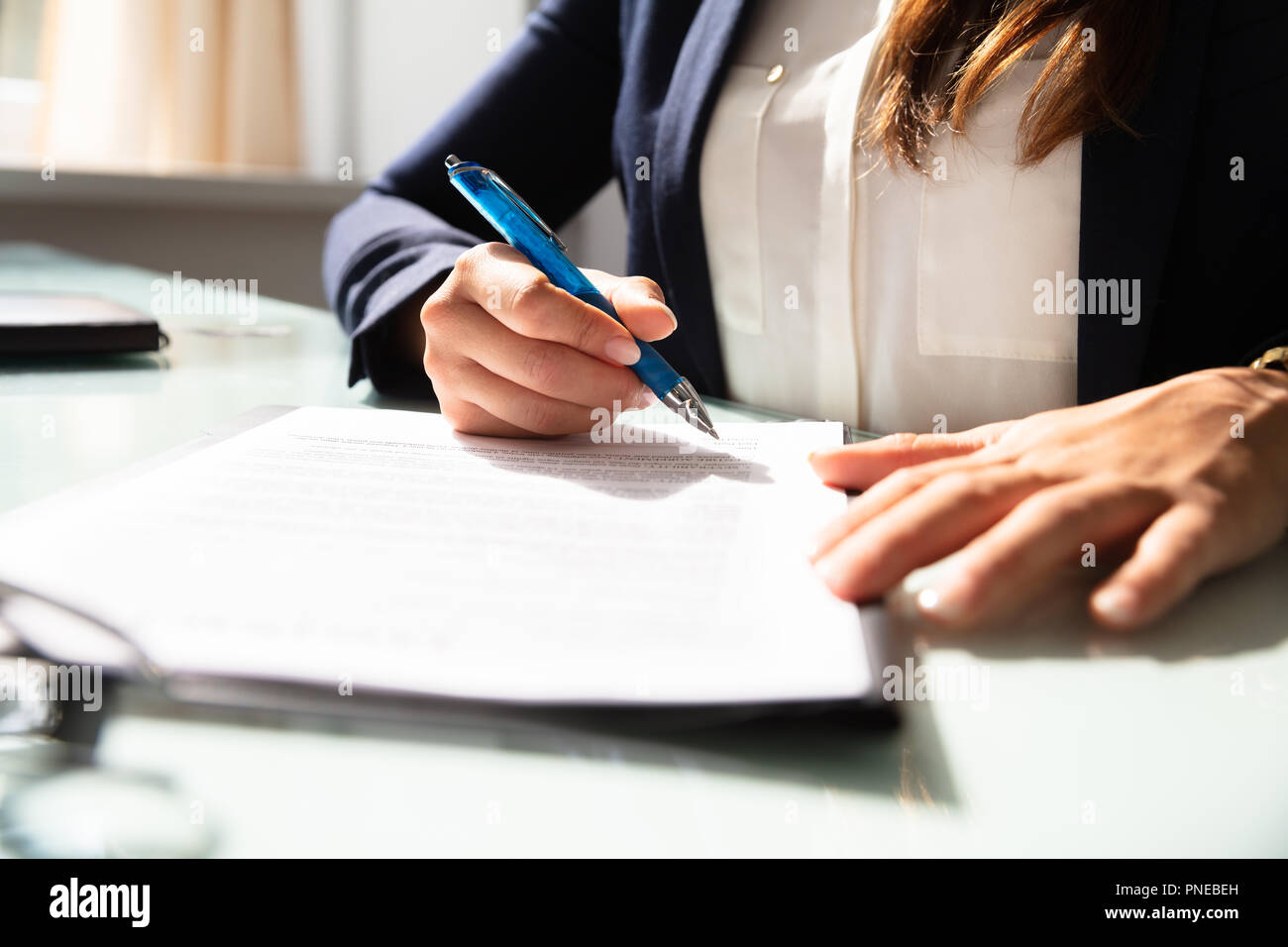 Close-up Of A Businesswoman's Hand Filling Contract Form Stock Photo ...