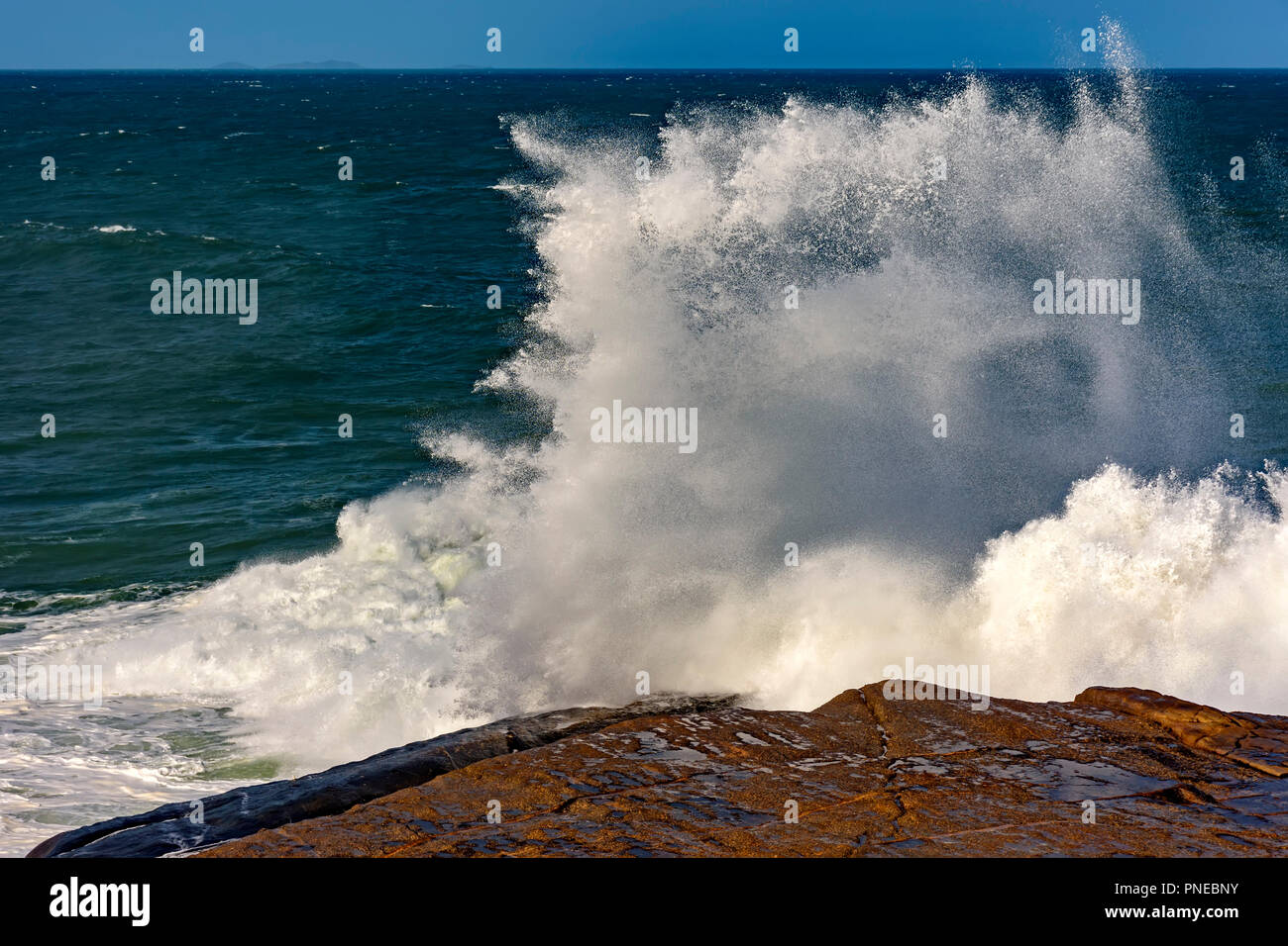 Storm wave breaking on the rocks of Ipanema beach in Rio de Janeiro ...