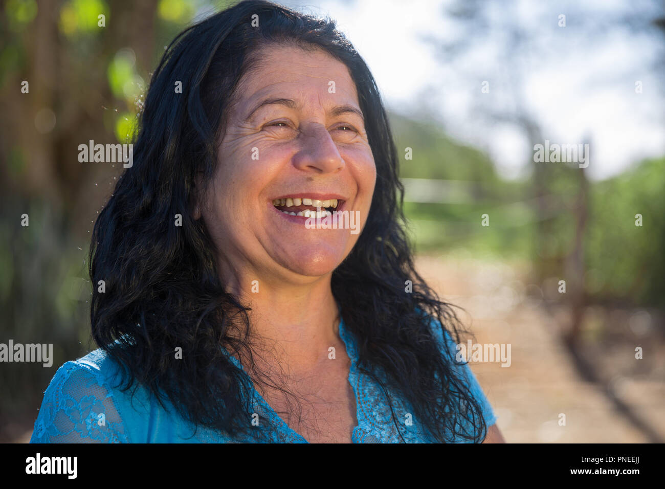 Lovely middle aged woman in the summer park - Laughing mature woman - An women smiling Stock ...