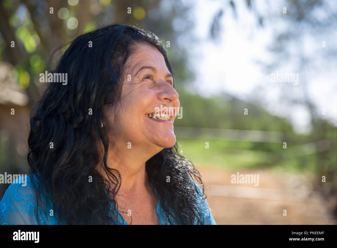 Lovely middle aged woman in the summer park - Laughing mature woman - An women smiling Stock ...