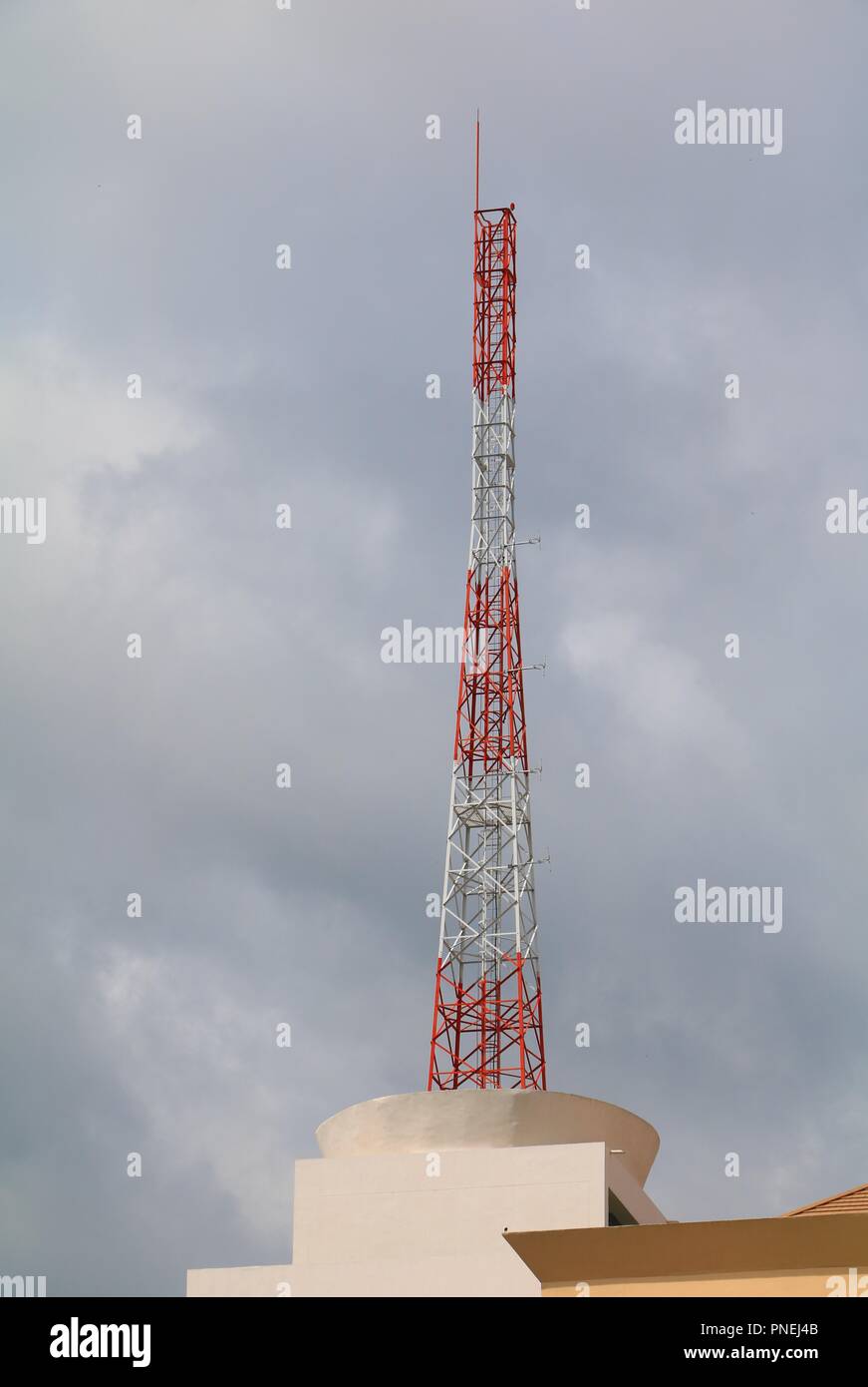 Telecommunication tower red and white antenna radio telephone mobile on ...