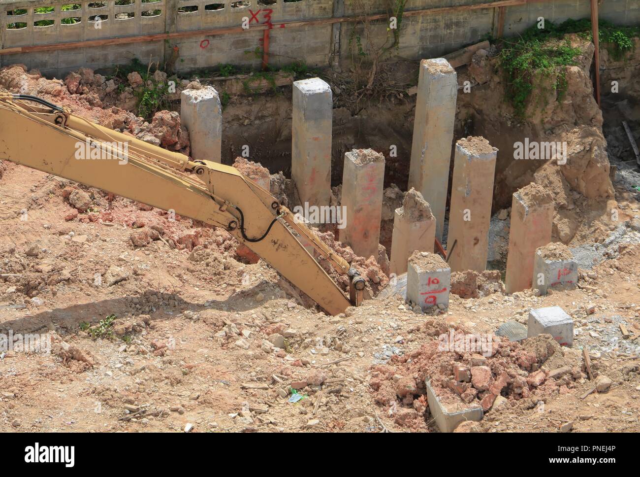 excavators work dig a hole in construction work industry at building ...