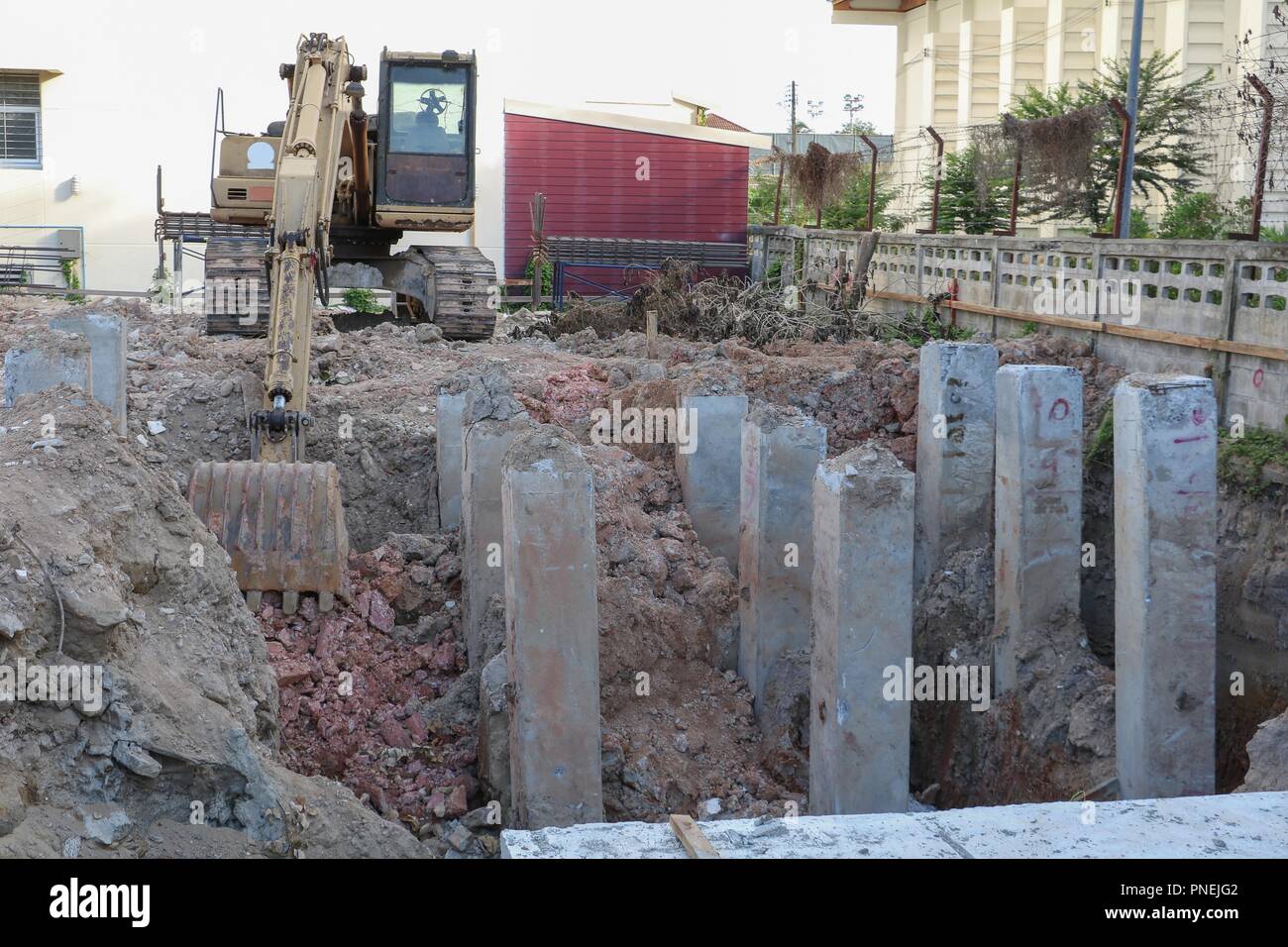 excavators work dig a hole in construction work industry at building ...