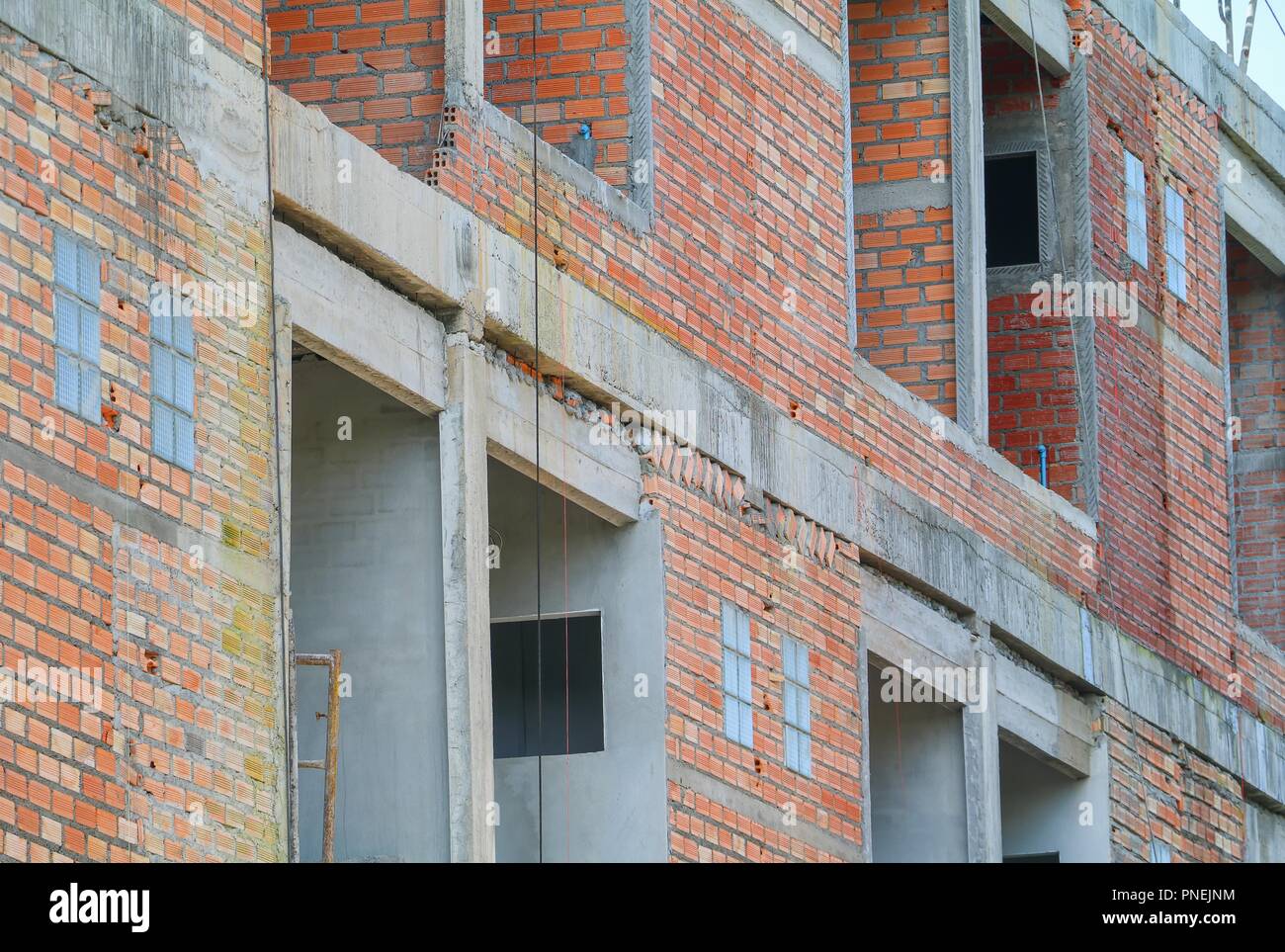 Construction work industry at building site Stock Photo - Alamy