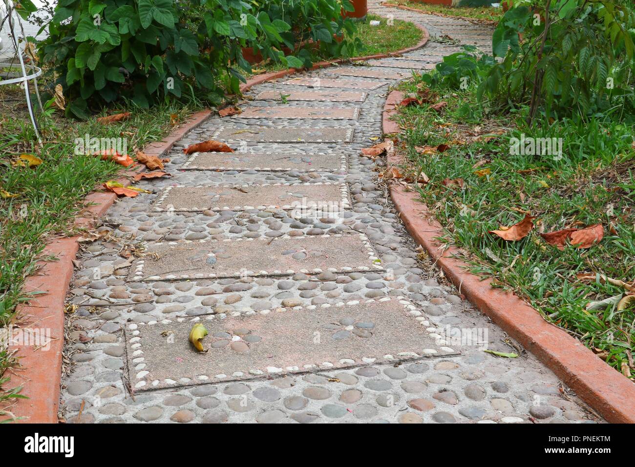 Stone walk way path in the park Stock Photo - Alamy