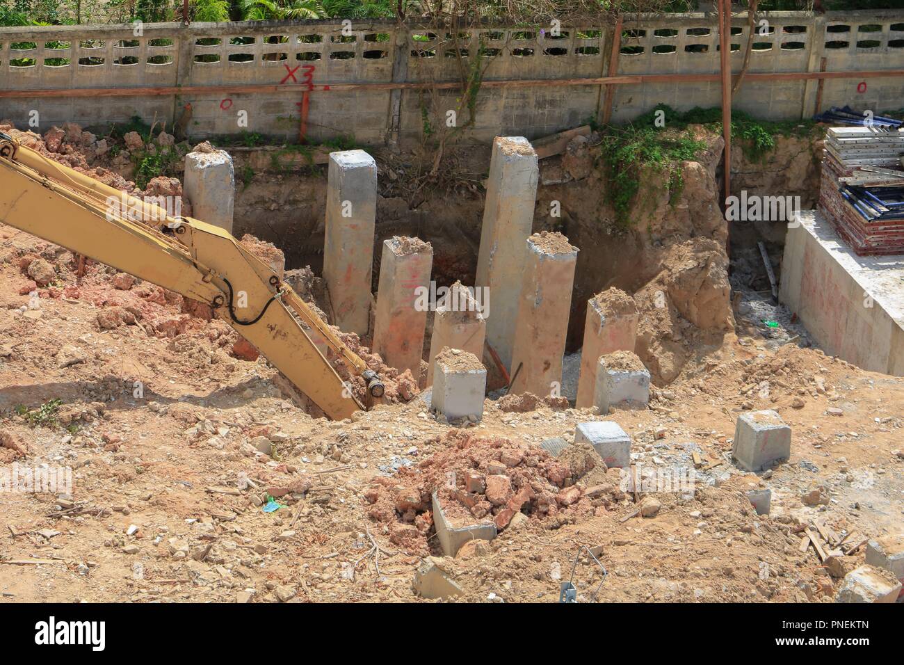 excavators work dig a hole in construction work industry at building ...
