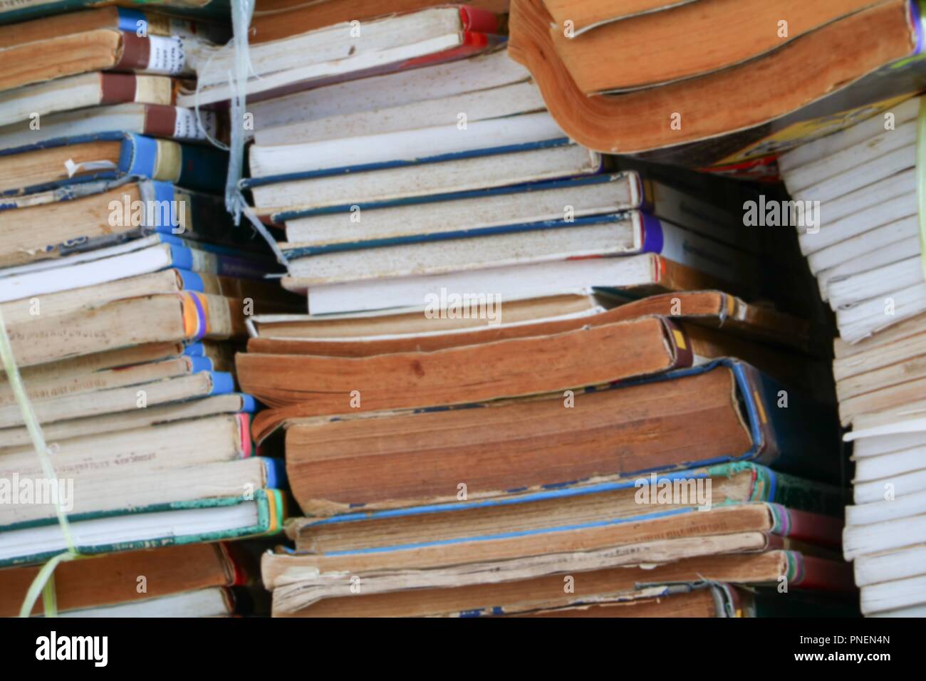 Blurred focus with Stack of Used Old Books in the School Library Stock ...