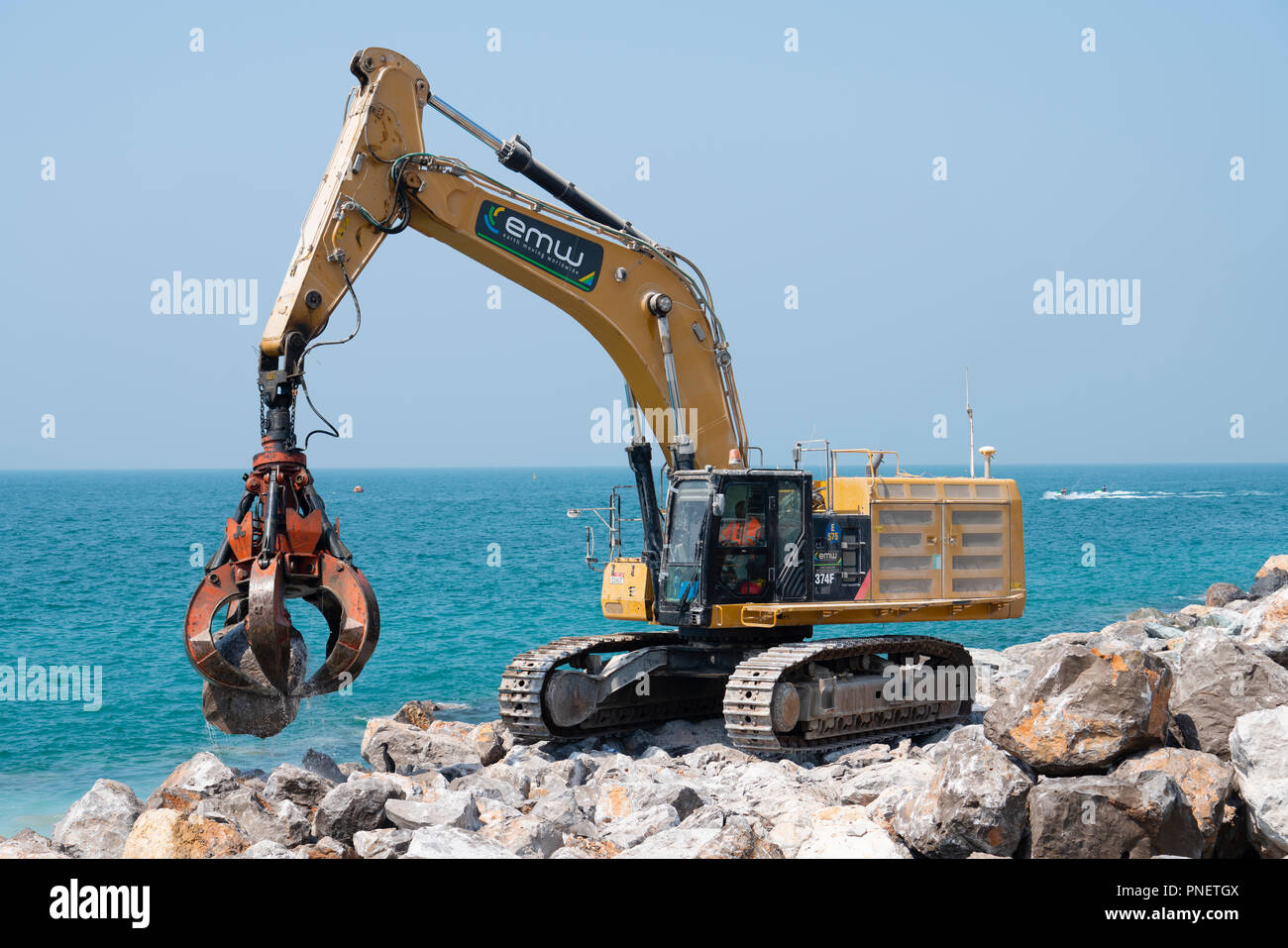 Sea defence construction work by placed large stones on shore on The ...