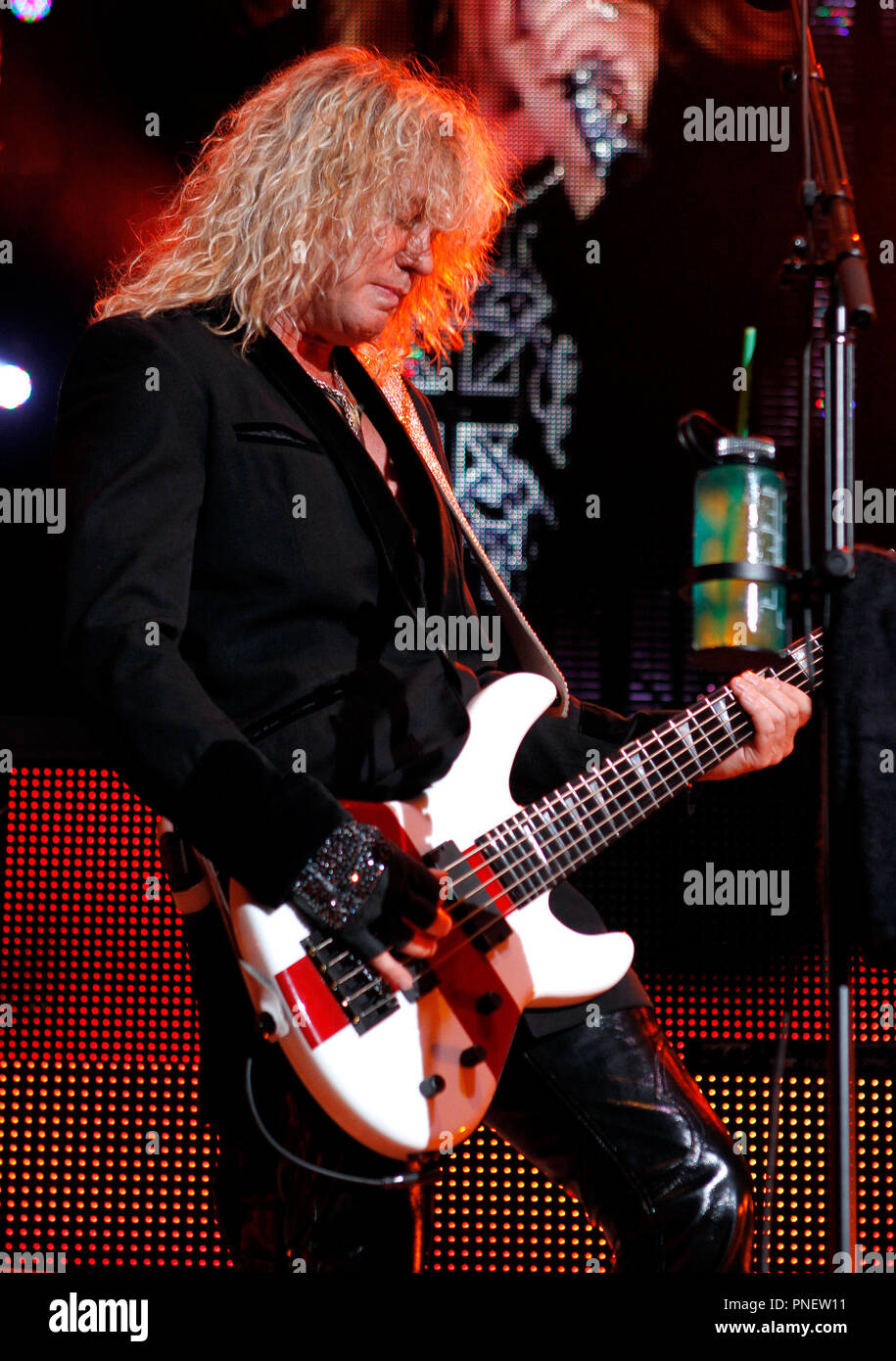 Rick Savage with Def Leppard performs in concert at the Cruzan ...