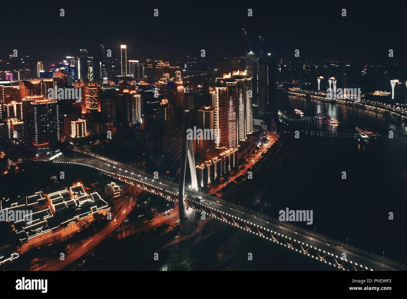 Aerial view of Bridge and city urban architecture at night in Chongqing ...