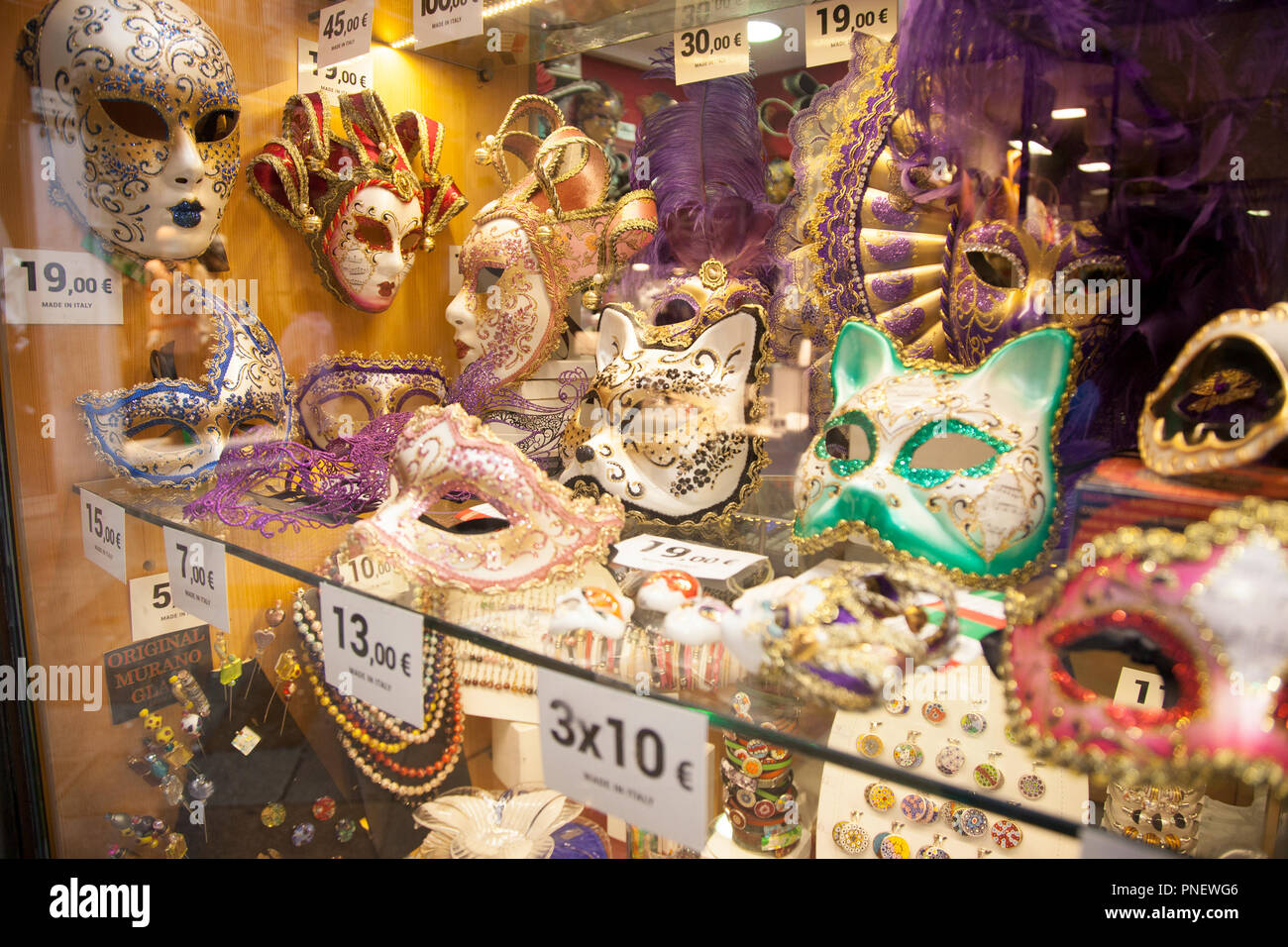 colorful venetian masks on display is storefront window Stock Photo - Alamy