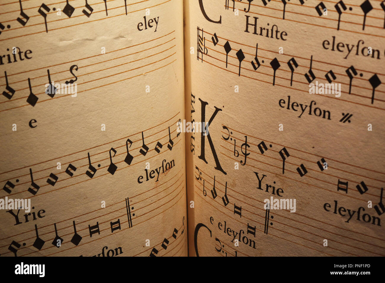 An old score written on a parchment, showing a few staves with notes ...