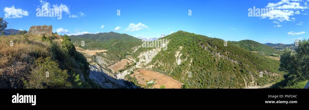 A landscape of cultivated fields, dense forest and mountains as seen ...