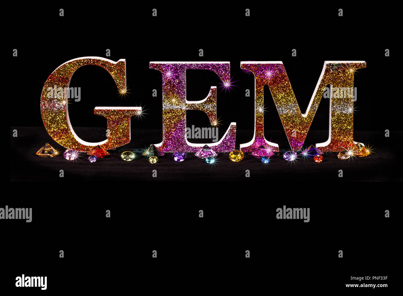 glitter gem letter and gem stones with construction of gem in black ...
