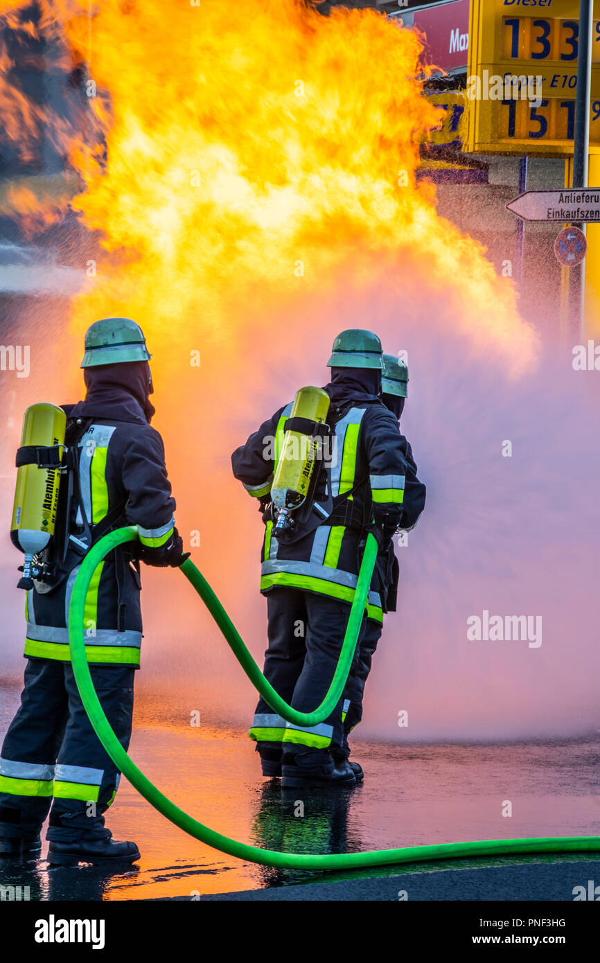 Firefighters in fire fighting, exercise, fire simulator for chemical ...