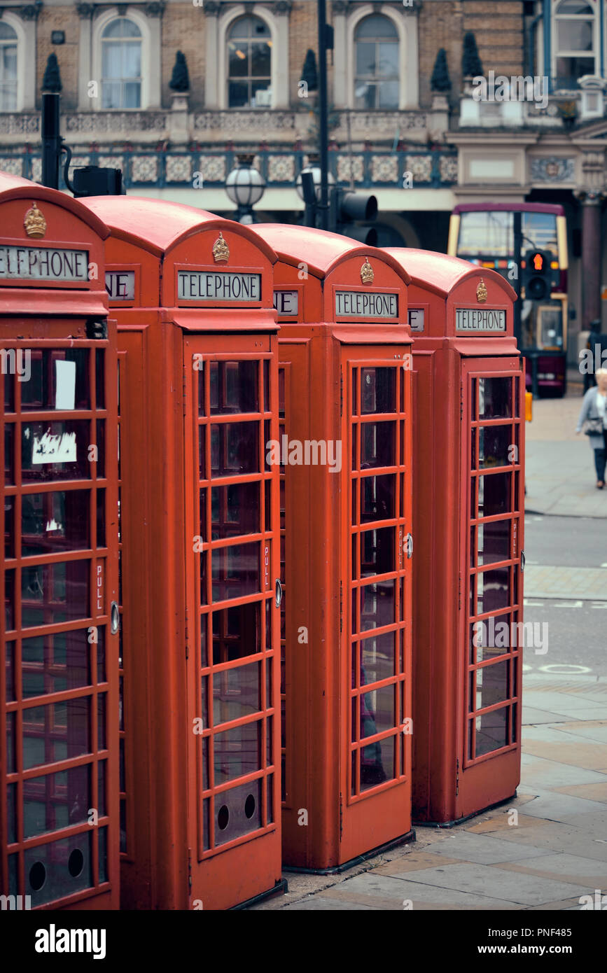 Red telephone box in street with historical architecture in London ...