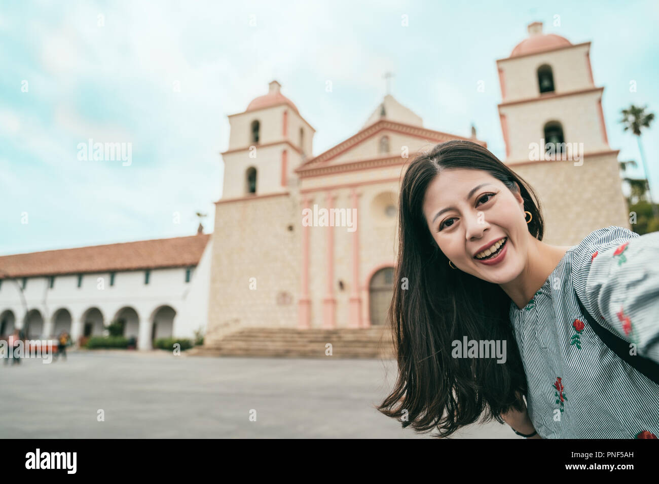 pretty and classy woman smiling and taking selfies joyfully with a ...