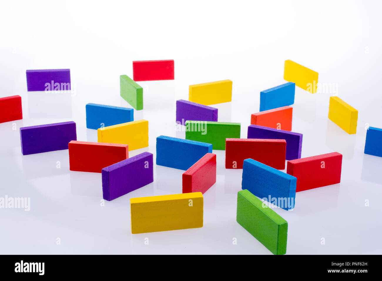 Color dominoes on a white background Stock Photo - Alamy