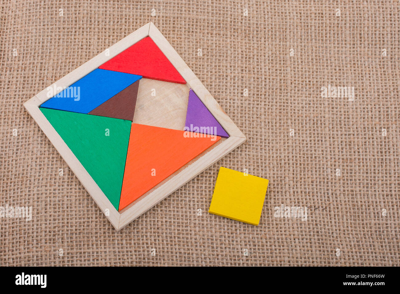 Colorful pieces of a square tangram puzzle Stock Photo - Alamy