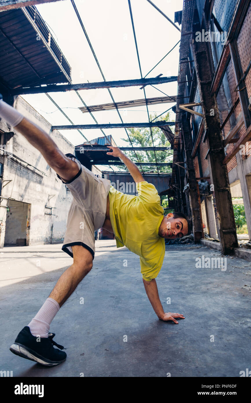 Guy on balance on one hand hi-res stock photography and images - Alamy