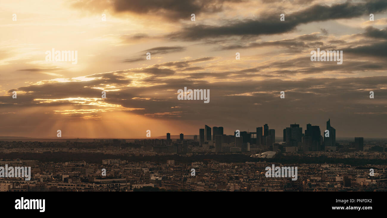 Paris city skyline rooftop view with la Defense at sunset, France Stock ...