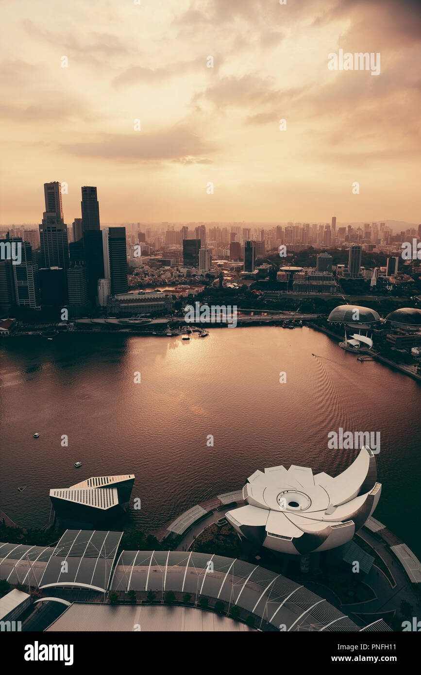 Singapore rooftop view of Marina Bay with urban skyscrapers at sunset ...