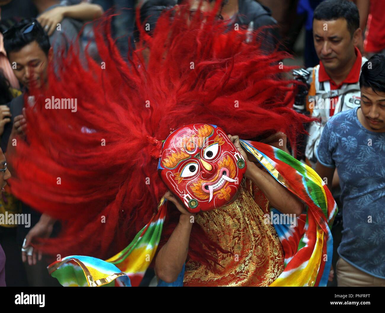 Kathmandu, Nepal. 21st Sep, 2018. A masked dancer "Lakhe" performs on ...