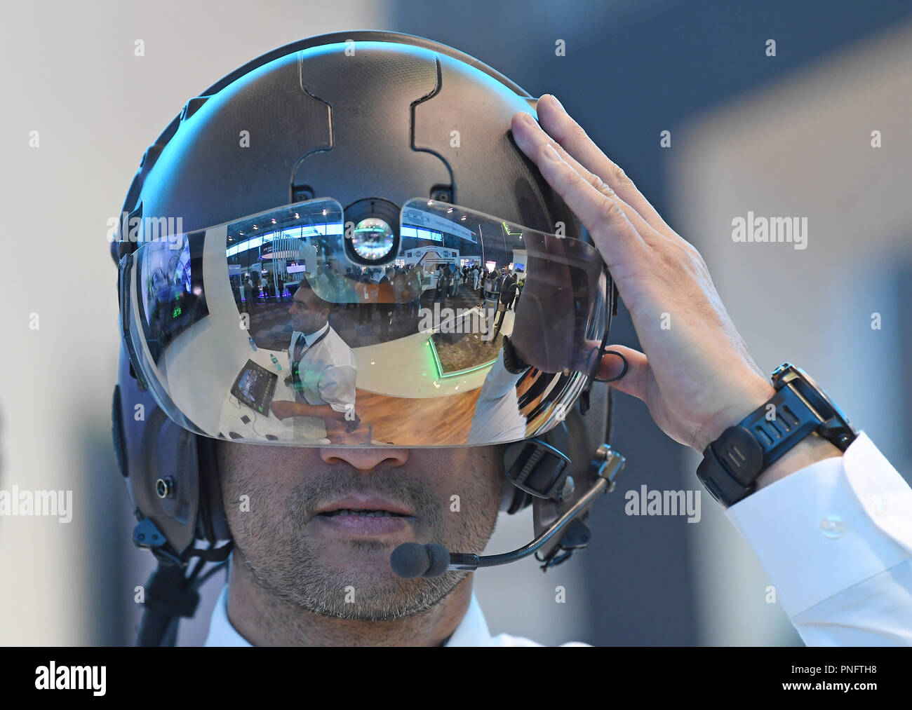 Pretoria, South Africa. 19th Sep, 2018. A visitor tries on a BAE ...