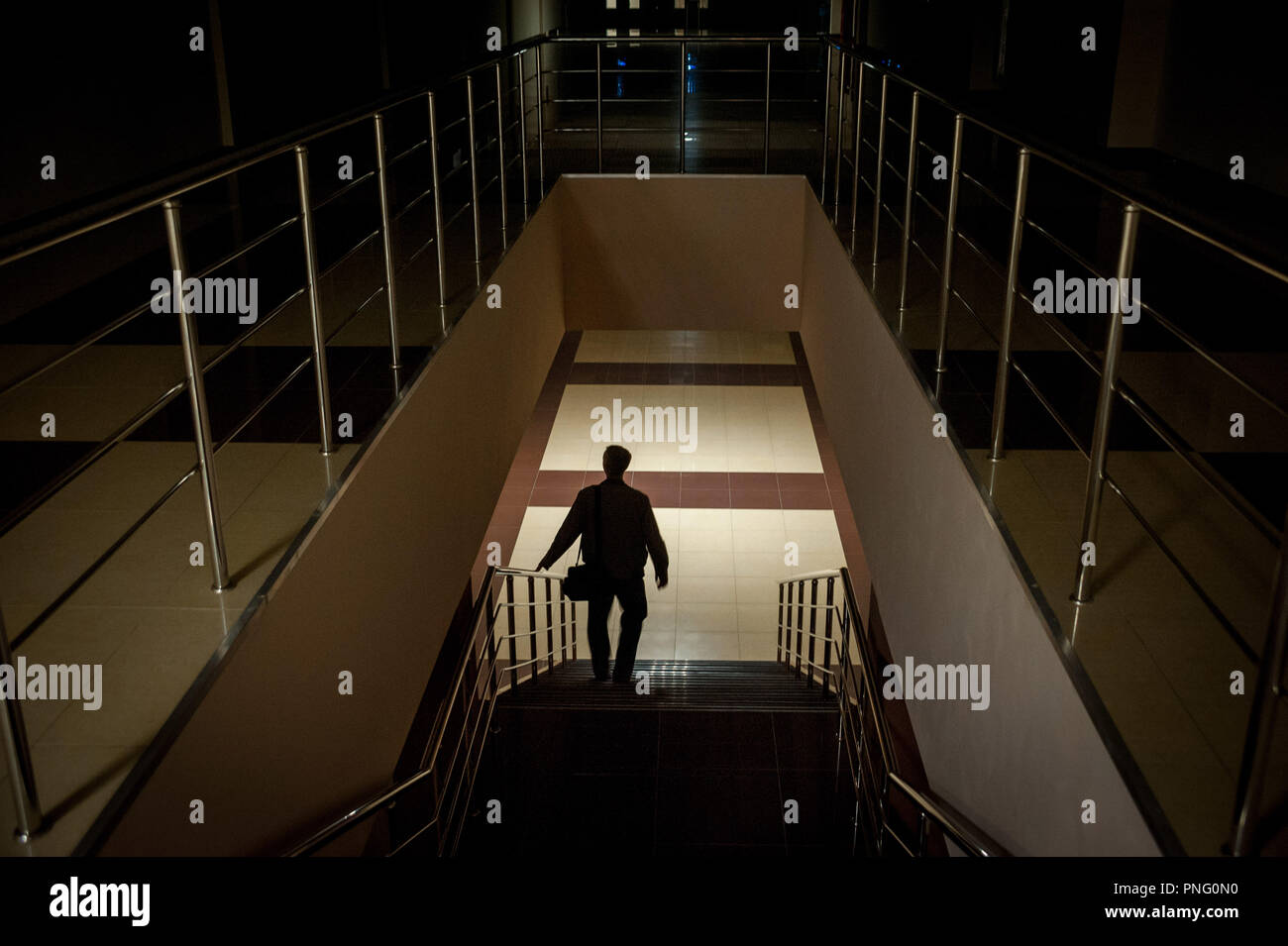 Man coming down stairs hi-res stock photography and images - Alamy
