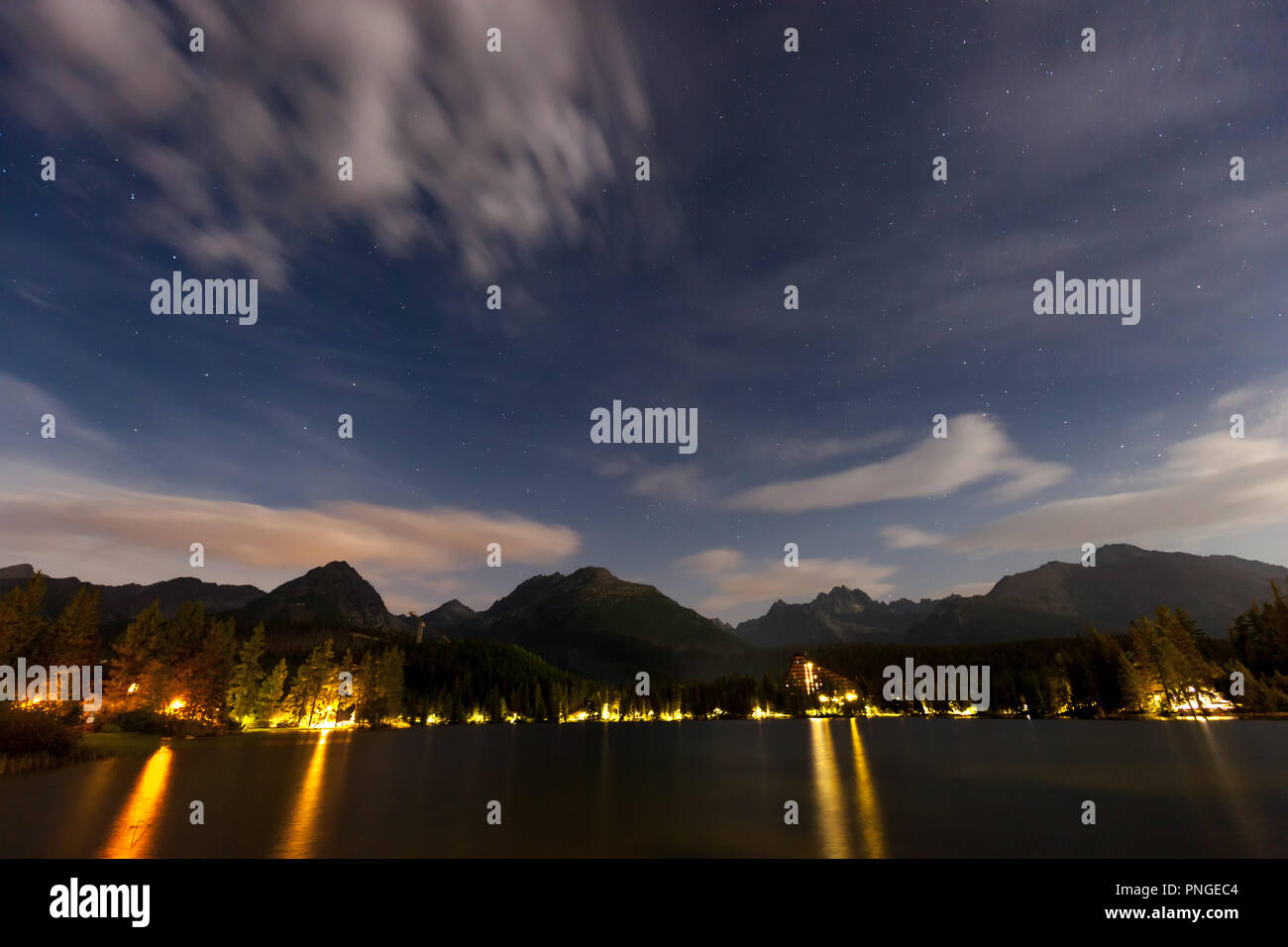 Night sky with stars over alpine mountain lake Stock Photo - Alamy