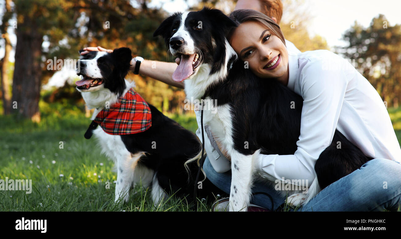 Beautiful woman walking in the park with her dog hi-res stock ...