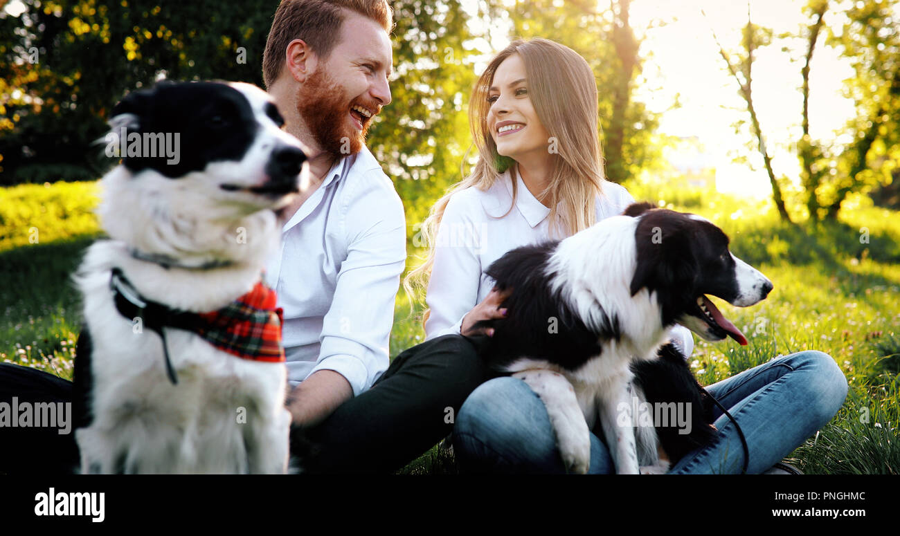 Couple walking a dog hi-res stock photography and images - Alamy