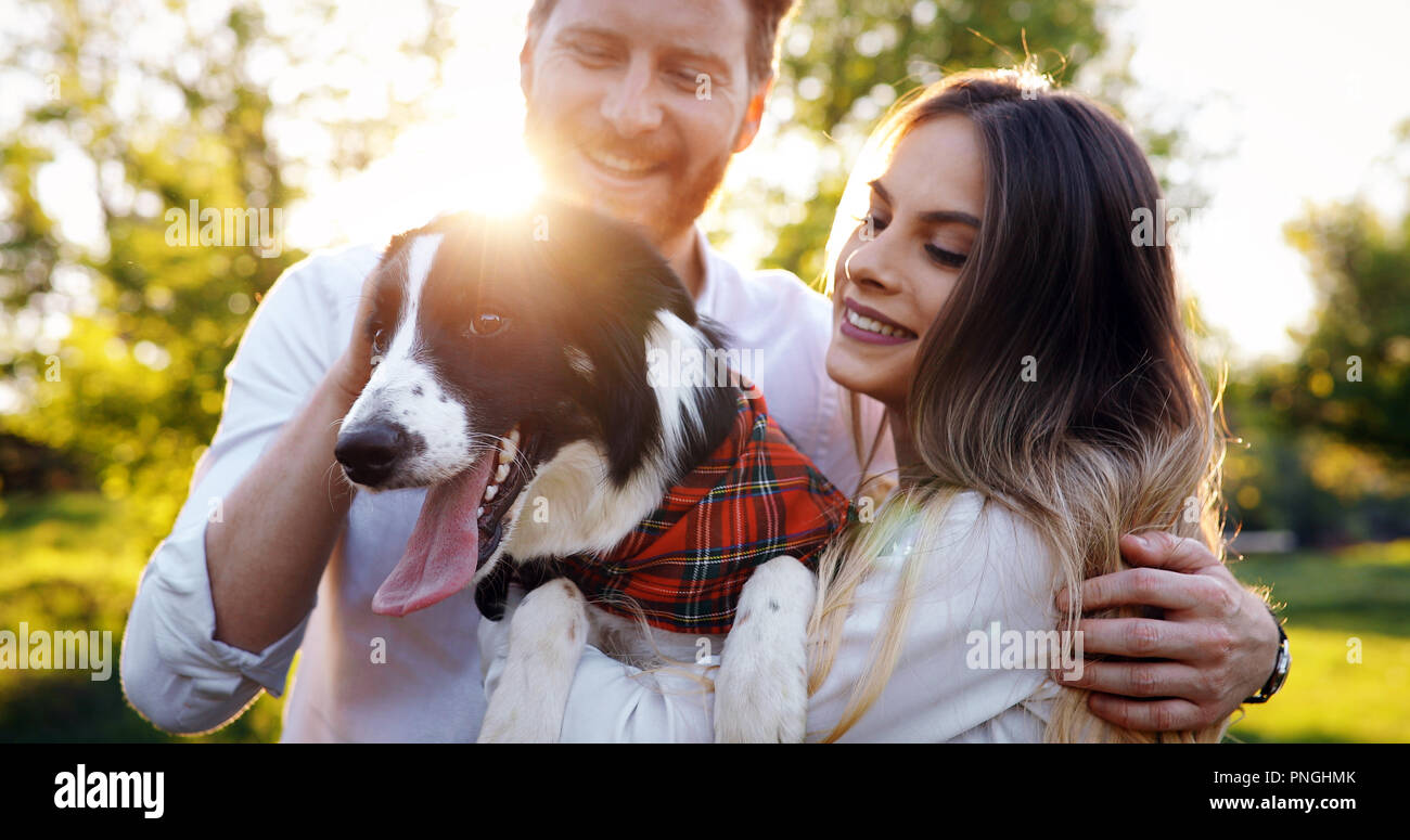 Romantic happy couple in love enjoying their time with pets Stock Photo ...