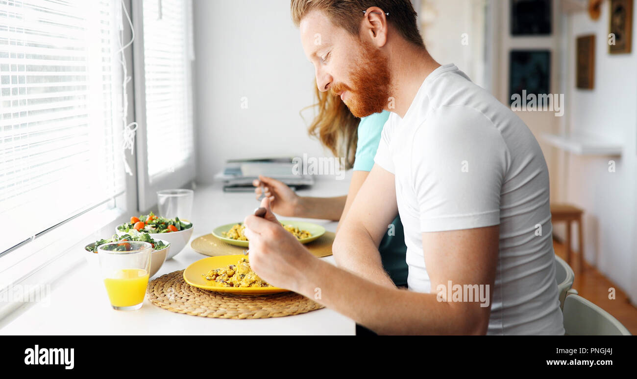 Couple in love having breakfast at home Stock Photo - Alamy