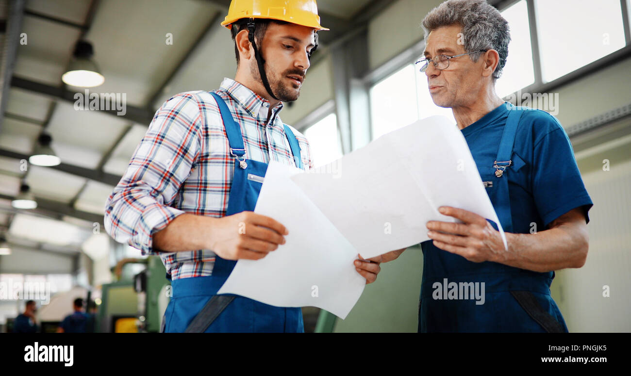Portrait of an handsome engineer in a factory Stock Photo - Alamy