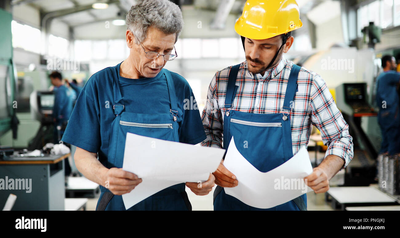Engineer Teaching Apprentices To Use Computerized cnc metal processing ...