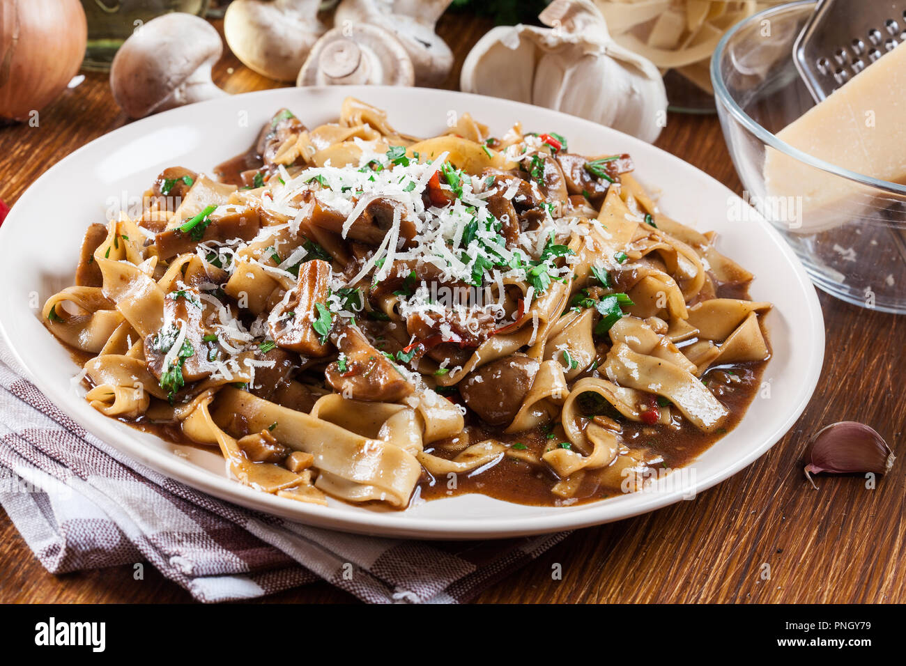 Tagliatelle pasta with champignon in mushroom gravy. Italian dish Stock ...