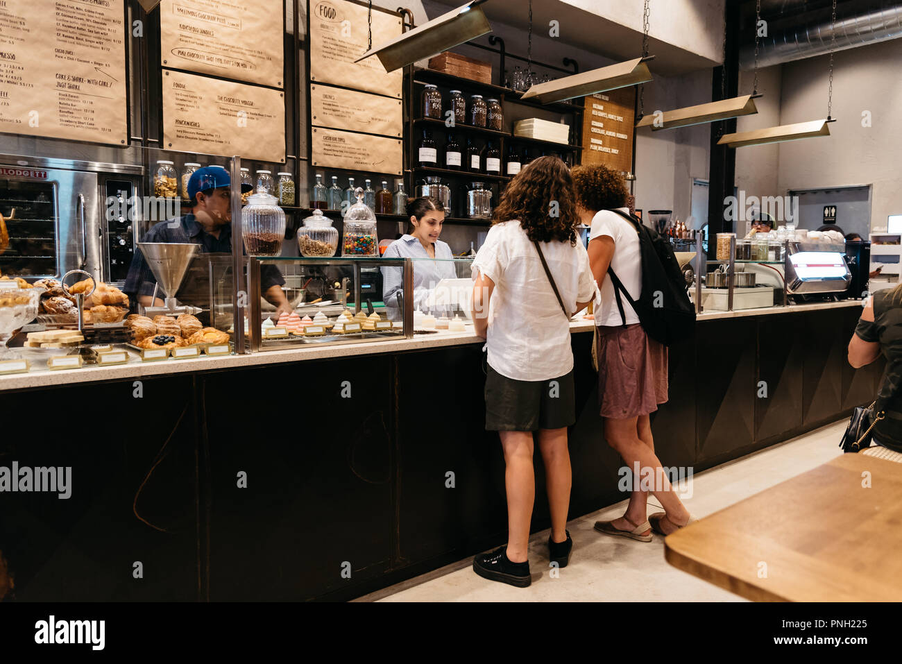 Ordering coffee counter hi-res stock photography and images - Alamy