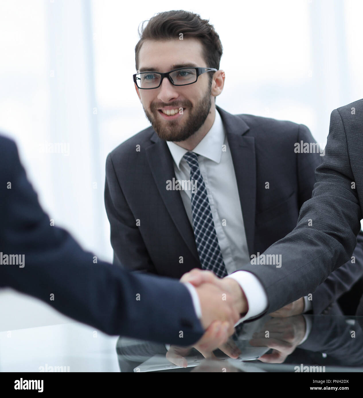 close up.businessman welcomes new business partner Stock Photo - Alamy
