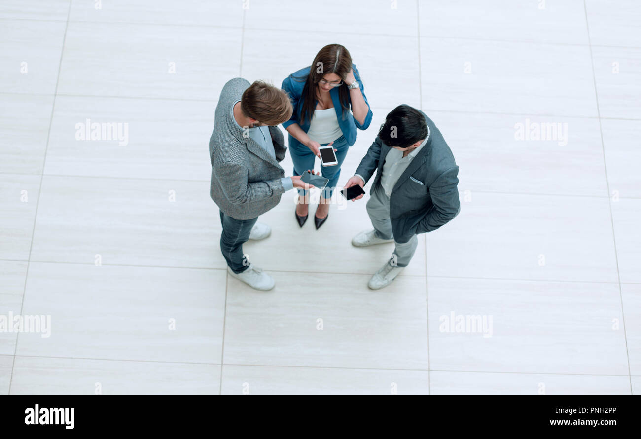 top view.business people are looking at their smartphones Stock Photo ...