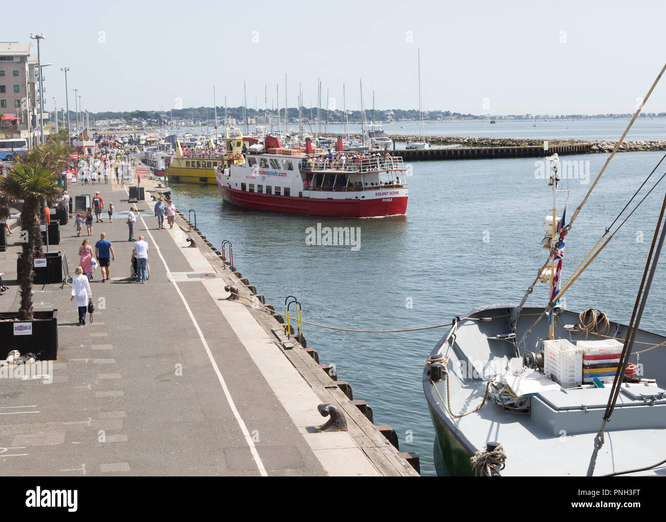 Pleasure boat trip cruises at quayside of Poole harbour, Poole, Dorset ...