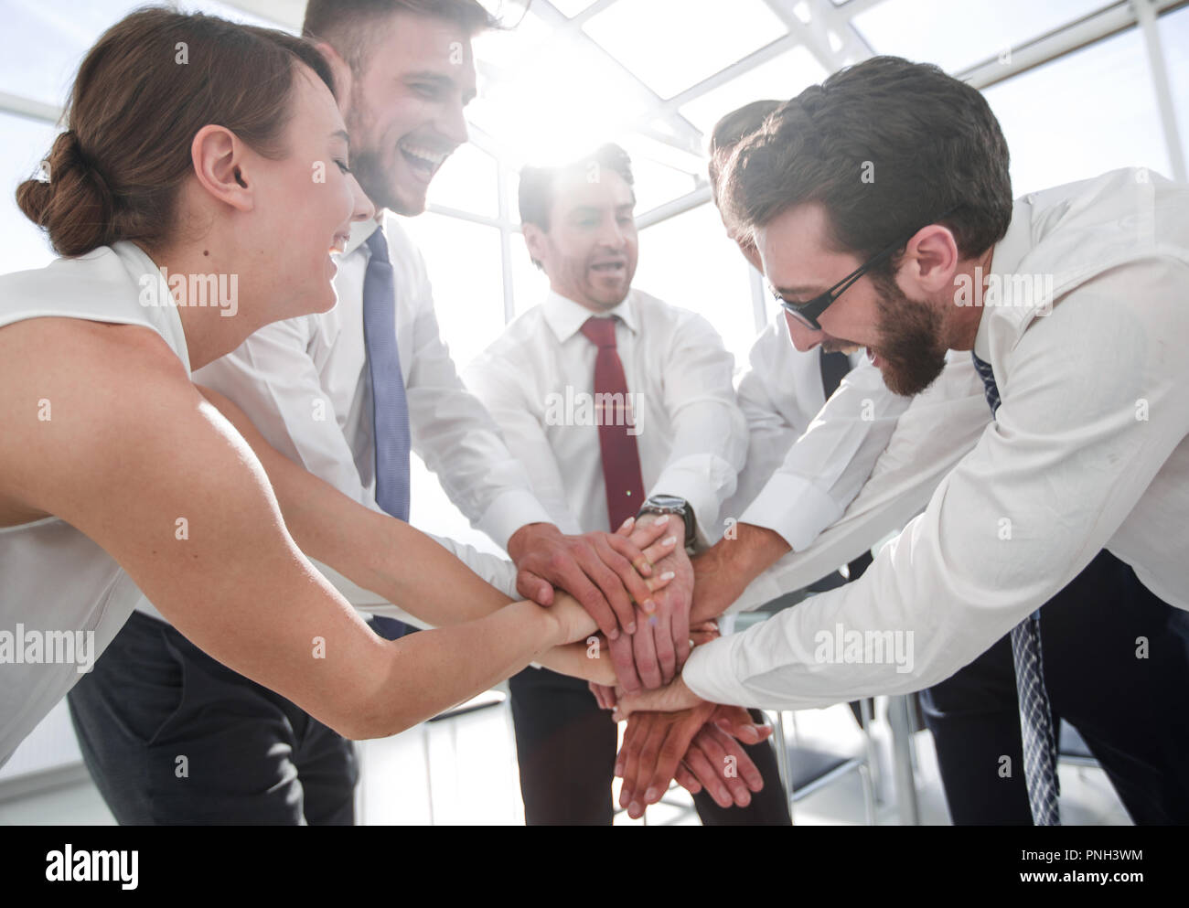successful colleagues join their hands together Stock Photo - Alamy