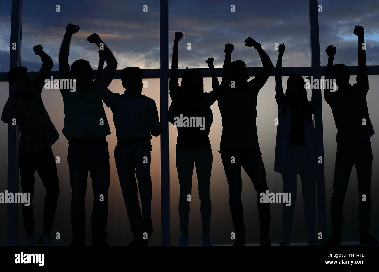 happy business team standing by the window Stock Photo - Alamy