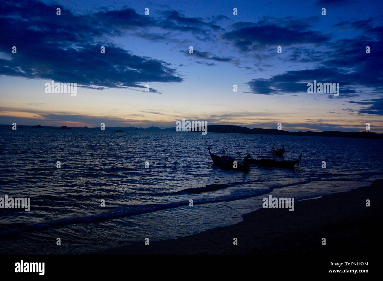 The sun is nearly completely gone, yet the sky illuminates blue and ...