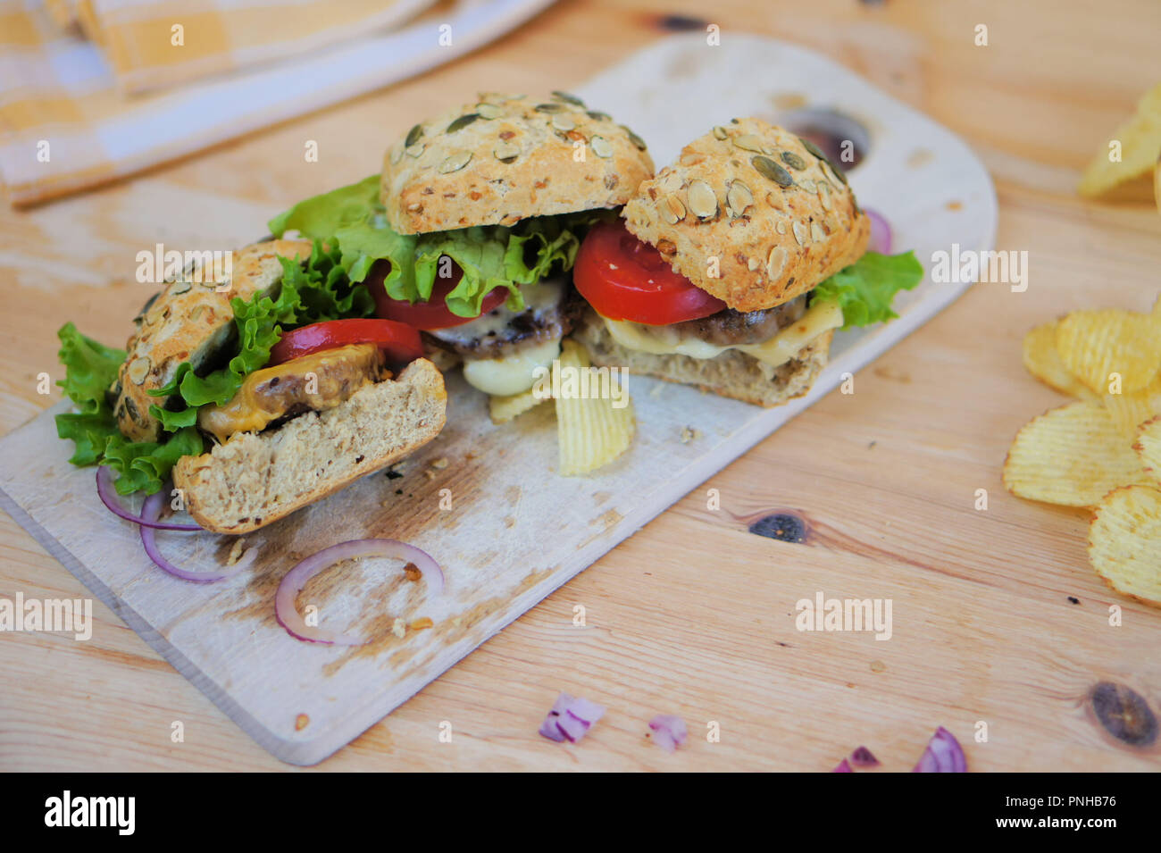 Several small cheeseburger sliders made from worm burger patties. The ...