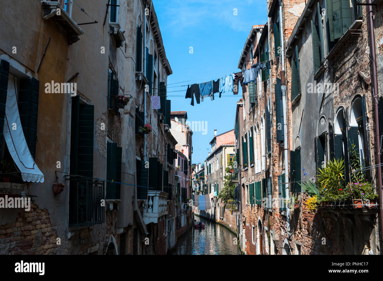 Canal and clothes drying on high washing line in Venice, Italy Stock ...