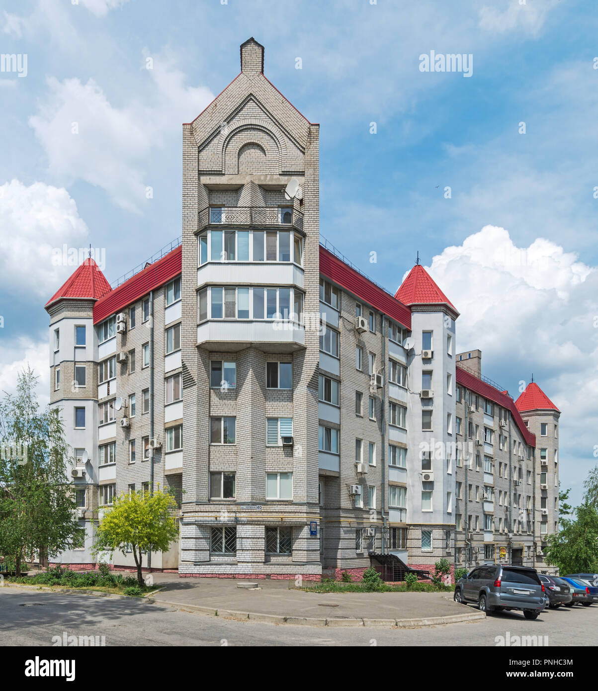 A multi-storey superior comfort building built of white brick and ...