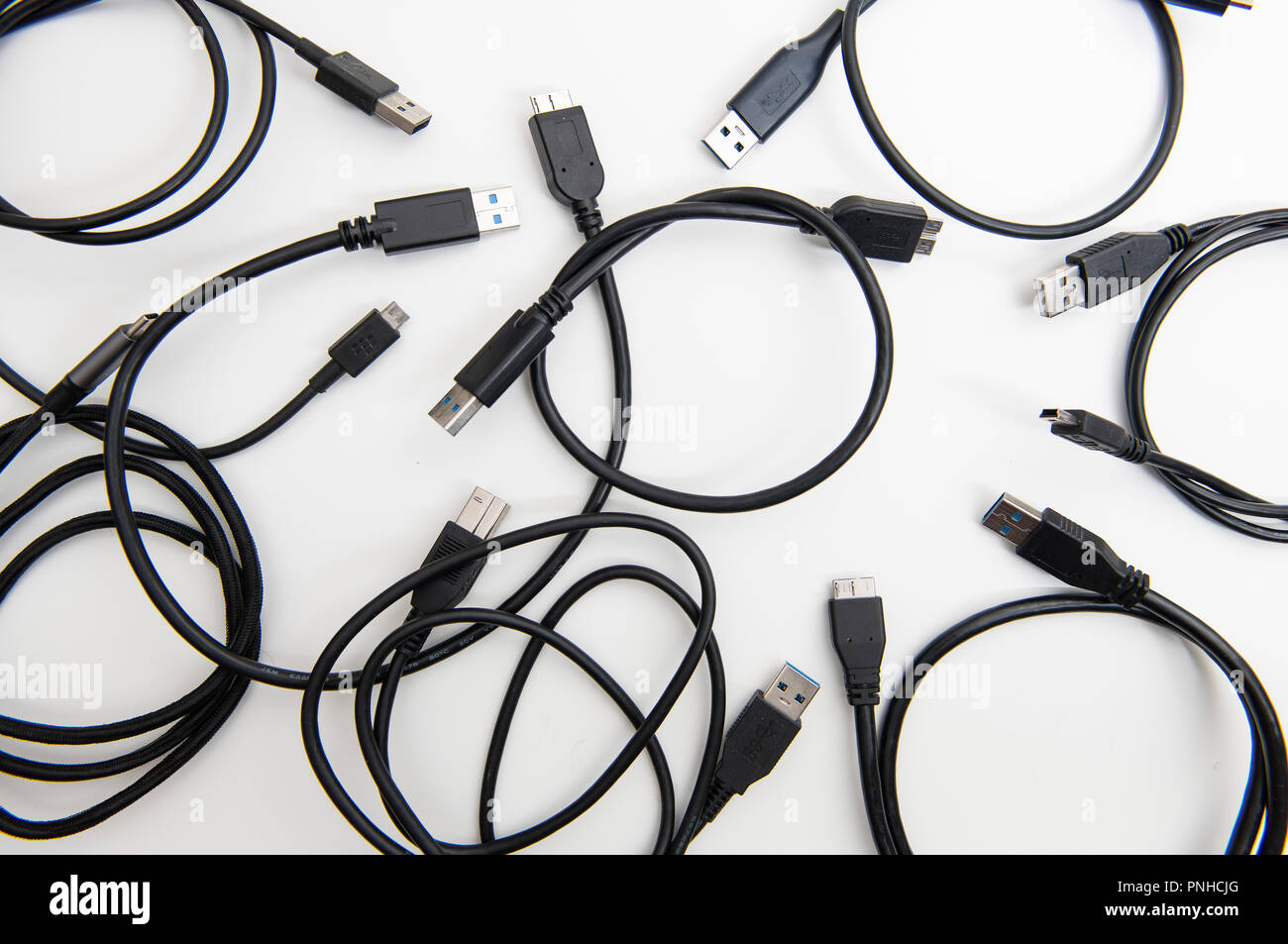 White desk with various USB cables Stock Photo - Alamy