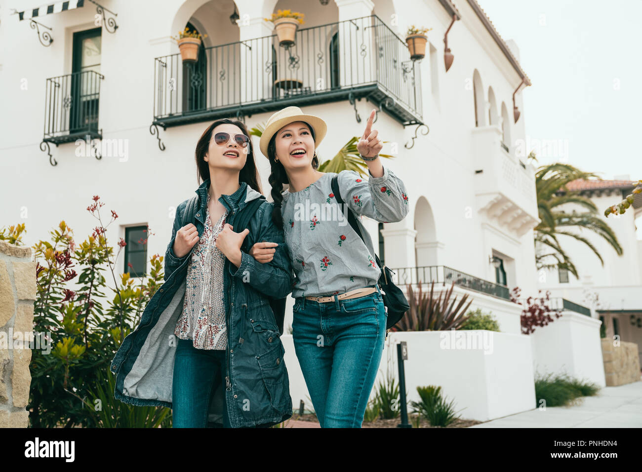 best friends hanging out happily while taking a trip to the old town ...